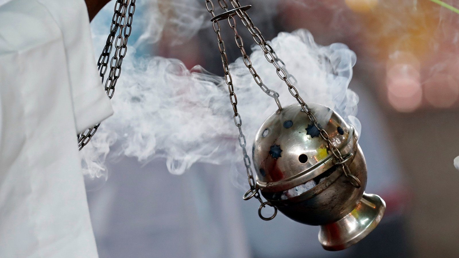 What It Means When A Priest Swings Incense Around A Casket